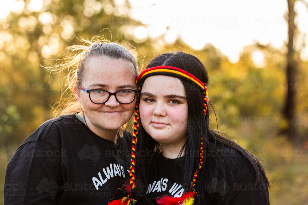 Image of Aboriginal mum and daughter together in golden light in ...