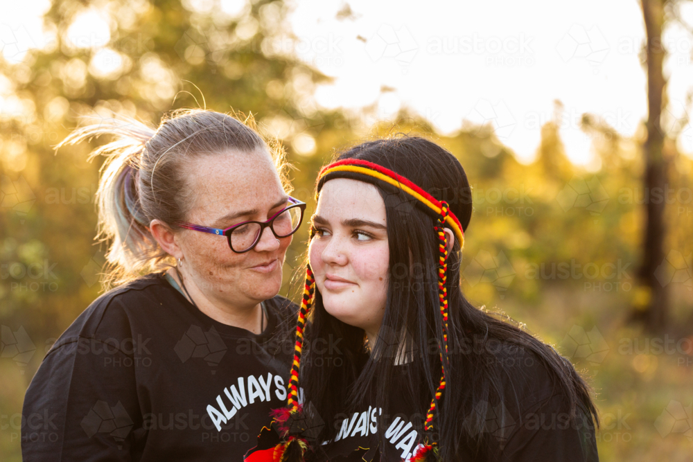 Image of Aboriginal mum and daughter together in golden light in ...