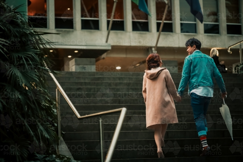 Image of Couple walking together up stairs at Treasury Gardens in ...