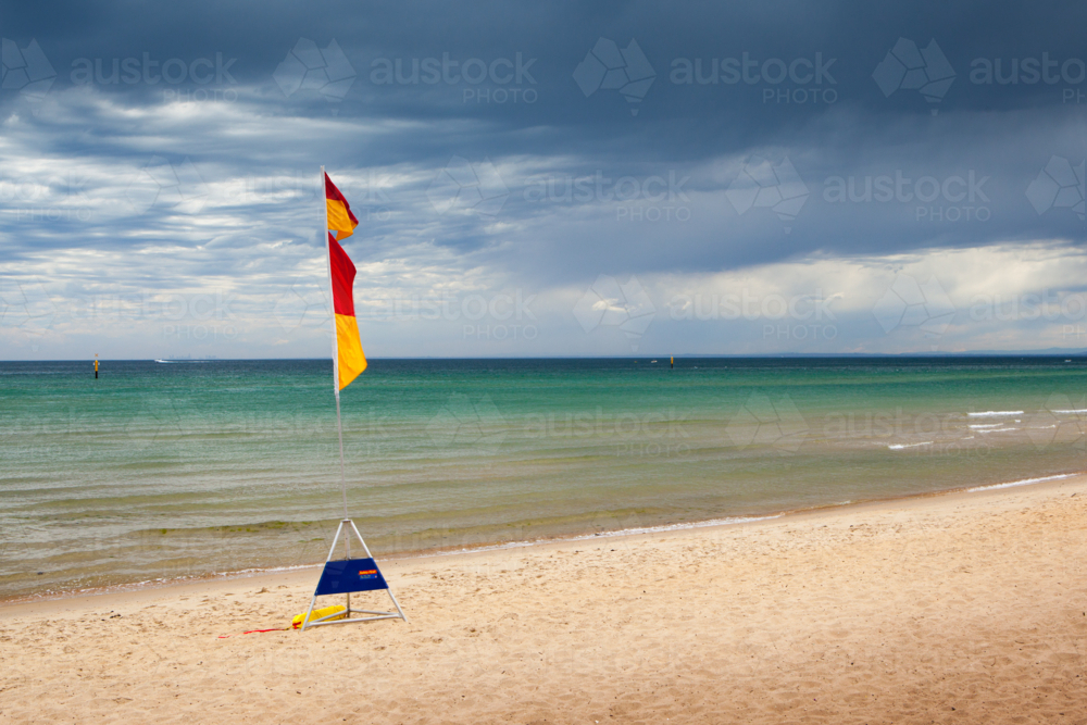 Image of Lifeguard flags on a stormy summer's afternoon in Mornington ...