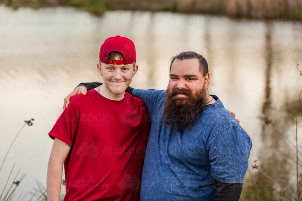 Image of Portrait of Aboriginal young man with dad - Austockphoto
