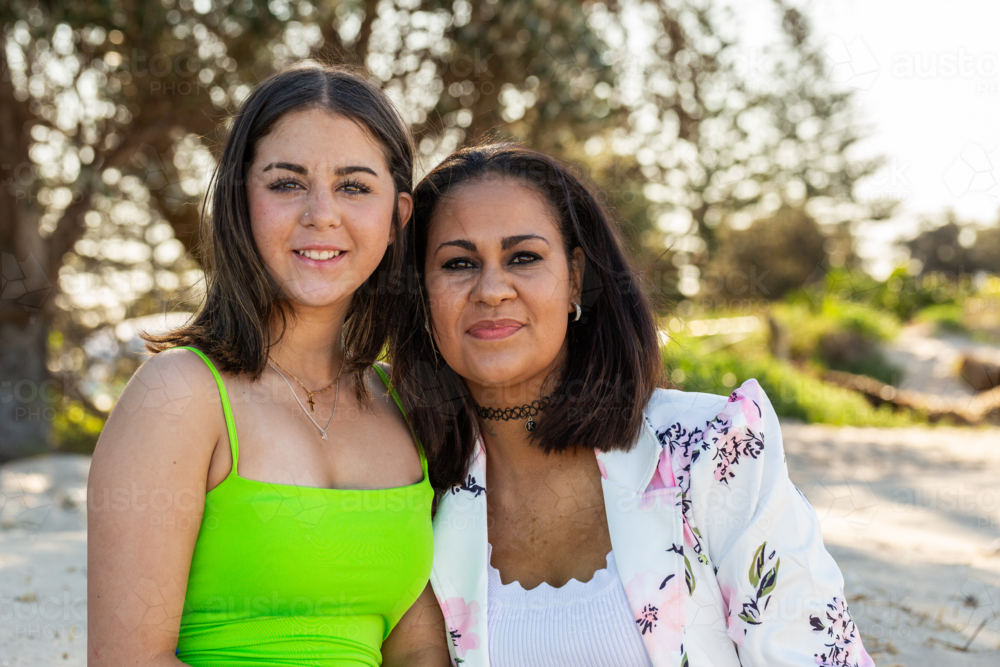 Image of Portrait of Torres Strait Islander mother in her thirties and young daughter together ...