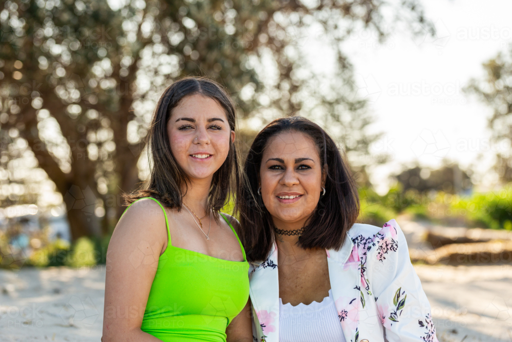 Image of Portrait of Torres Strait Islander mother in her thirties and young daughter together ...