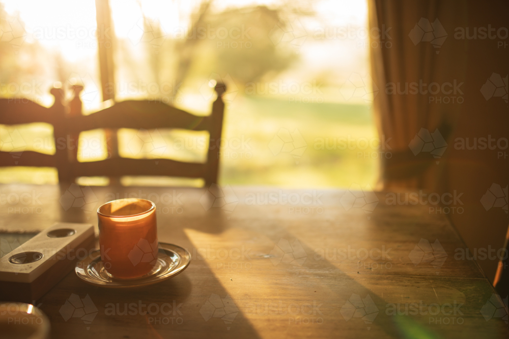 Image of Warm morning sunlight beaming through window of country home ...